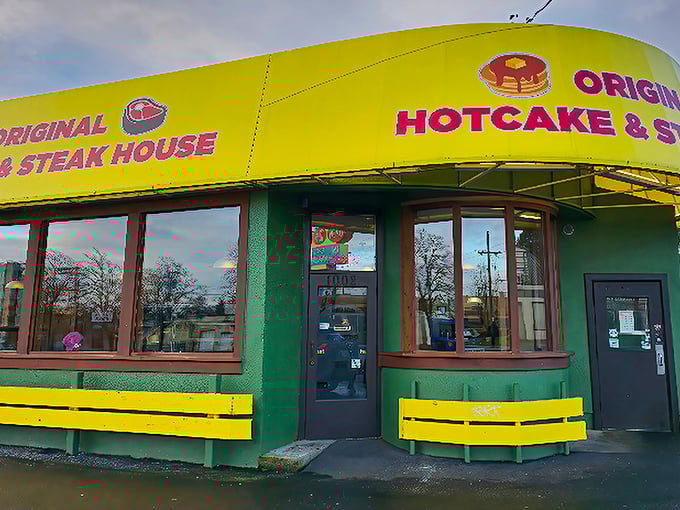 The unmistakable yellow and green exterior of Original Hotcake House stands like a breakfast beacon in Portland, promising comfort food salvation 24 hours a day.