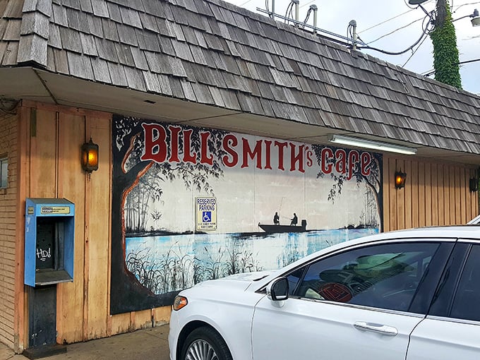 The iconic mural outside Bill Smith's Cafe tells you everything you need to know—this place values fishing, food, and small-town charm equally.