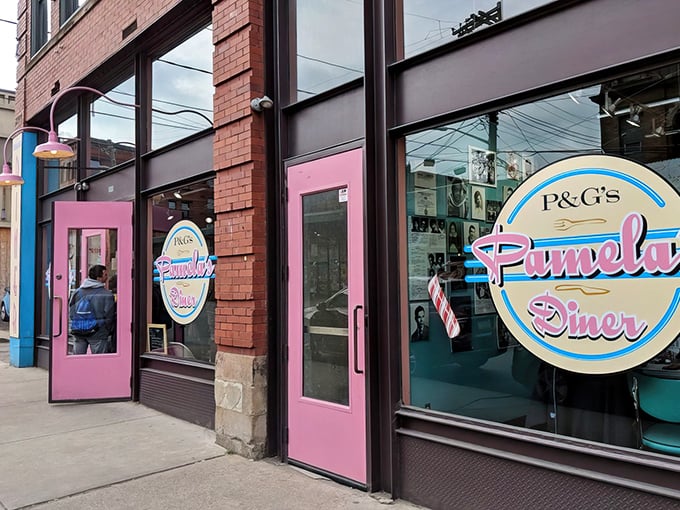 Those pink doors aren't just an entrance to a diner—they're a portal to pancake paradise. The retro signage promises a breakfast experience worth writing home about.