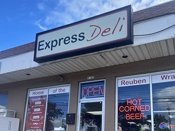 The neon "HOT CORNED BEEF" sign isn't just advertising—it's a beacon of hope for sandwich lovers seeking refuge from chain restaurant mediocrity.