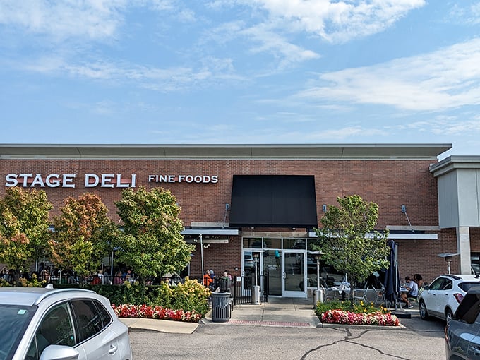 The brick exterior of Stage Deli stands proud in West Bloomfield Township, where locals queue up for what might be Michigan's most authentic deli experience.