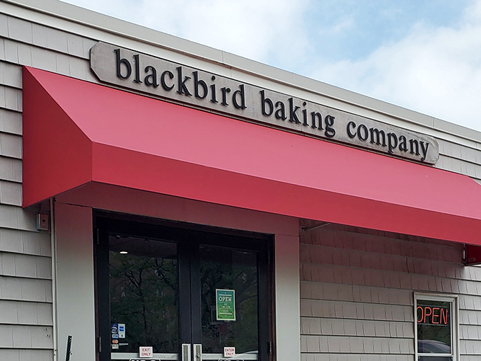 The iconic red awning of Blackbird Baking Co. beckons like a culinary lighthouse on Lakewood's shore, promising carb-laden treasures within.