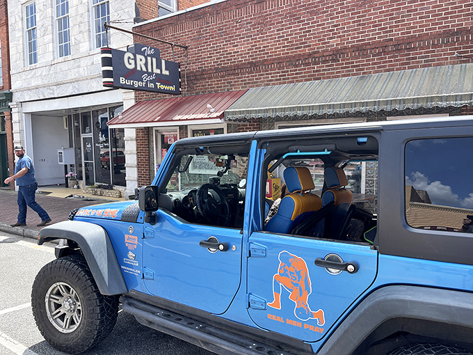 The brick facade and vintage sign of The Grill in Hawkinsville promises what every great roadside find should: the "Best Burger in Town" isn't just a claim—it's a mission statement.