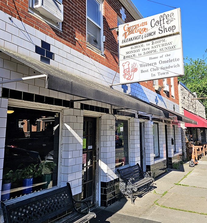 Sunlight dances across the vintage sign promising the "Best Club Sandwich In Town" – a bold claim this humble diner actually delivers on.