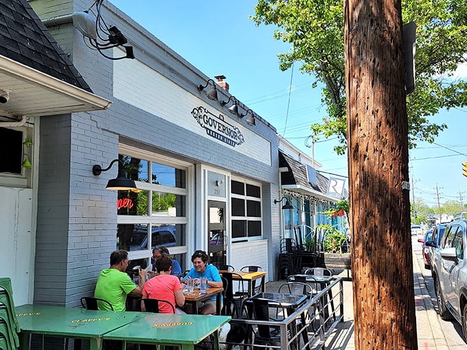 The Governor's crisp white exterior and inviting patio seating create the perfect small-town backdrop for culinary magic in historic Milford.