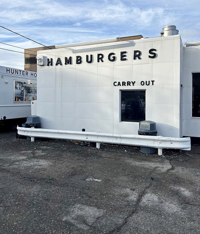 The gleaming white exterior of Hunter House stands like a time capsule on Birmingham's streets—a burger beacon that's been drawing devotees for generations.