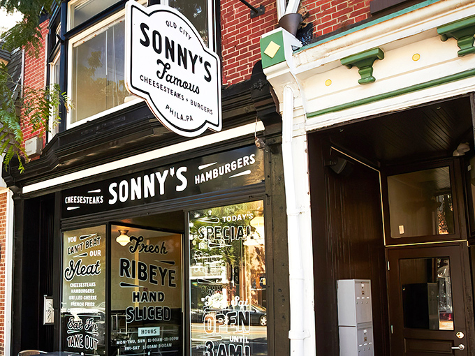 The black and white storefront speaks volumes: "Fresh Ribeye Hand Sliced" isn't just signage—it's a solemn promise to your taste buds.