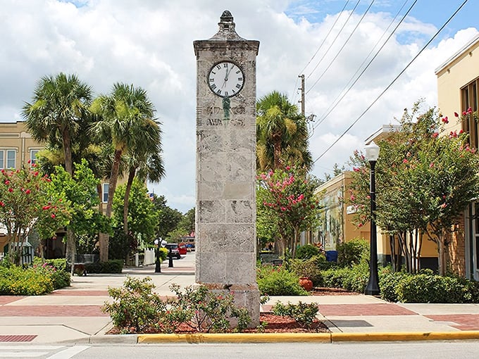 Lake Wales' historic clock tower stands like a dignified timekeeper, surrounded by palm trees and flowering shrubs that seem to be showing off just a little.