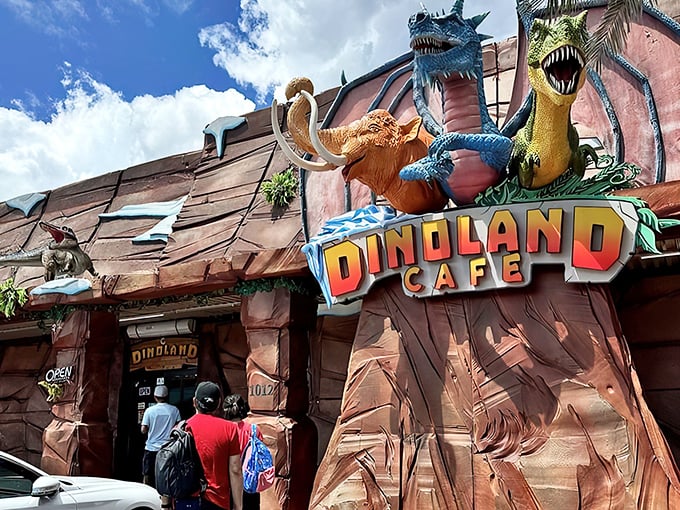 The exterior of DinoLand Cafe looks like a movie set that escaped from Hollywood, complete with a dinosaur sentinel guarding the entrance.