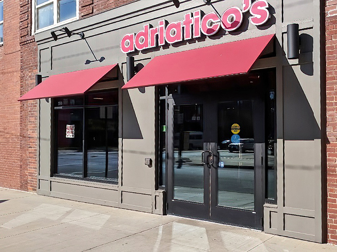 The iconic red awnings of Adriatico's beckon pizza lovers like a lighthouse guides ships – a beacon of cheesy hope on the Columbus landscape.
