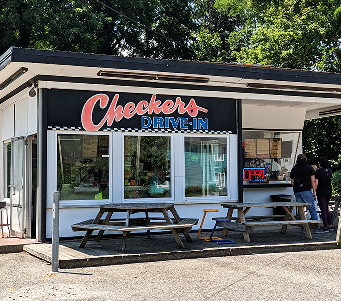 The classic black and white checkerboard pattern isn't just decoration—it's a promise that time-honored flavors await inside this unassuming Perry treasure.