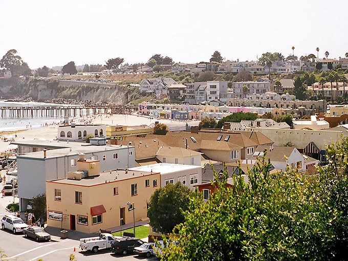 Capitola's iconic rainbow-hued Venetian Court buildings reflect in Soquel Creek like a Mediterranean daydream that somehow landed in California.
