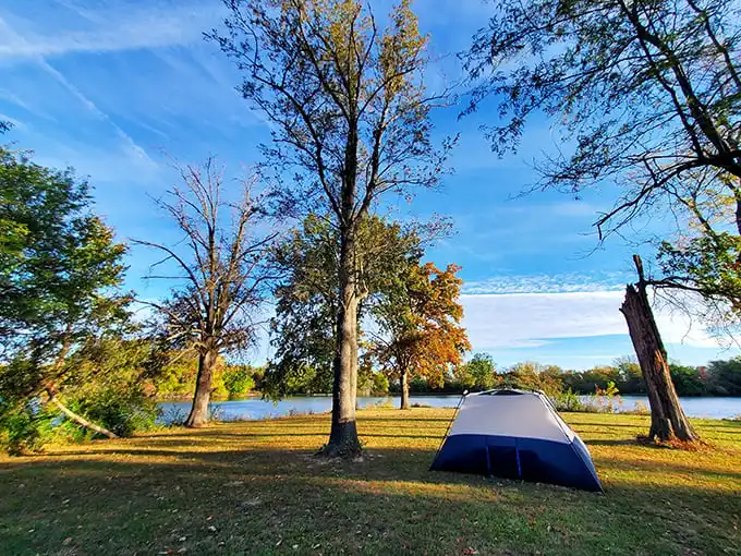A tent pitched at sunset with the lake shimmering behind – nature's five-star accommodations without the pesky room service charges.