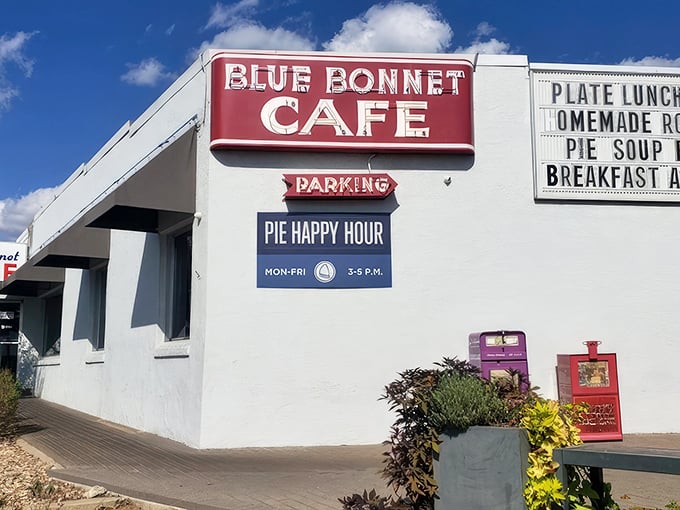 That iconic red sign beckons like a lighthouse for hungry travelers. Pie Happy Hour? Now that's civilization at its finest!
