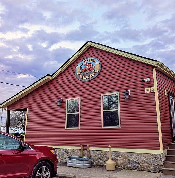 That iconic red siding and playful logo tell you everything you need to know: serious barbecue happens here, no fancy frills required.