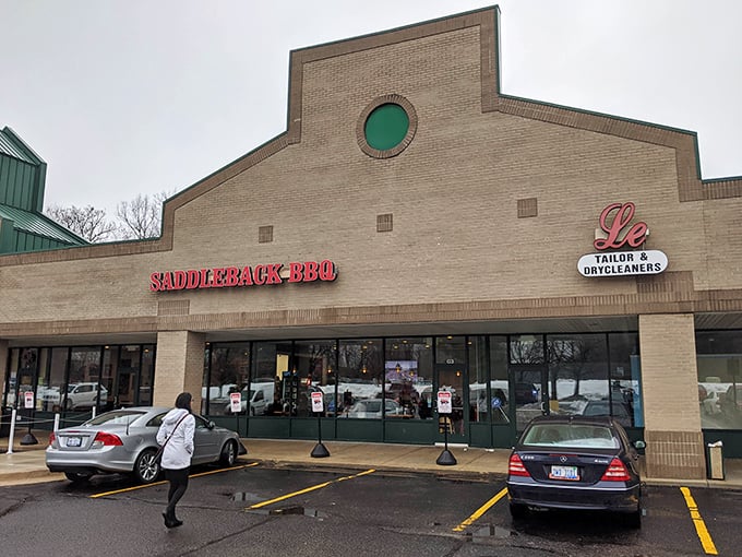 The unassuming strip mall exterior of Saddleback BBQ proves once again that the best barbecue often hides in plain sight, like a smoke ring waiting to be discovered.