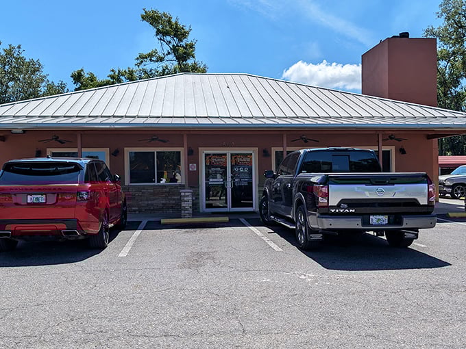 The unassuming exterior hides a smoky treasure trove where pickup trucks outnumber sports cars – always a good sign.