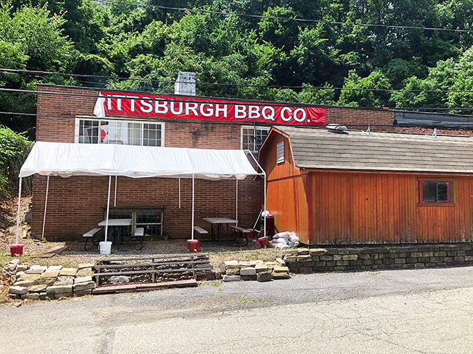 The little red barn that could! Pittsburgh BBQ Company's distinctive exterior promises smoky delights within, like a barbecue beacon calling hungry travelers home.