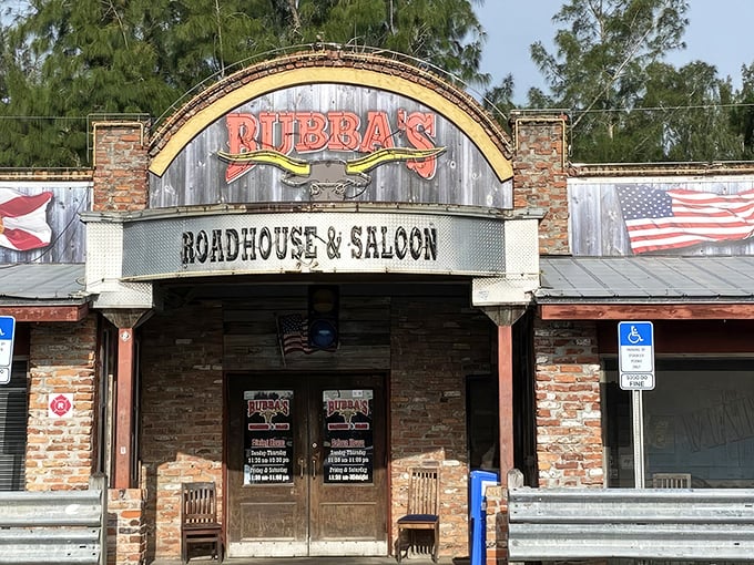 The unassuming yellow exterior of Bubba's Roadhouse & Saloon stands like a beacon of hope for hungry travelers. No fancy frills, just the promise of honest-to-goodness good food inside.
