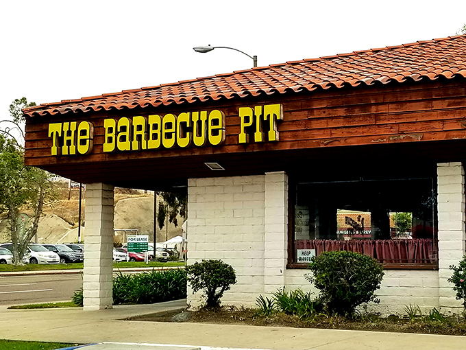 The unassuming exterior of The Barbecue Pit stands as a testament that culinary greatness doesn't need flashy signage—just decades of smoke-infused expertise.