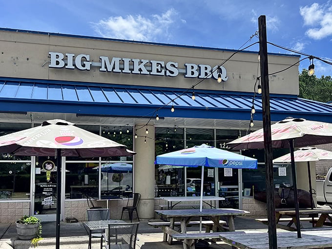 String lights and colorful umbrellas frame the entrance like a beacon to barbecue pilgrims. This isn't just a restaurant—it's a destination for those serious about their smoked meats.