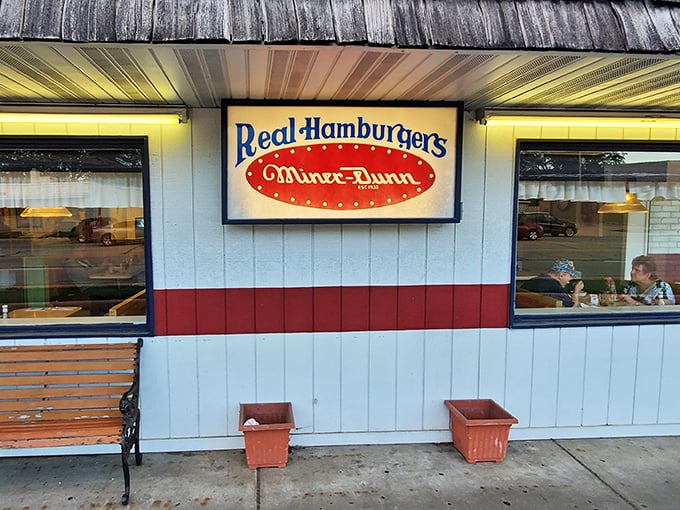 The iconic white and red exterior of Miner-Dunn proudly announces "Real Hamburgers" – a promise they've kept since Herbert Hoover was president.