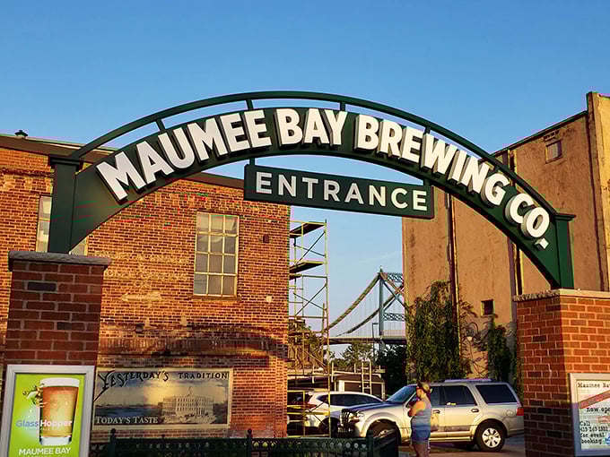 The iconic archway welcomes you like an old friend, promising cold brews and warm memories beneath that Toledo sky.