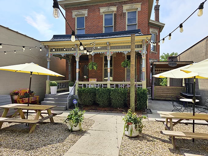 String lights, picnic tables, and the promise of smoky delights—this outdoor seating area is where summer BBQ dreams come true.