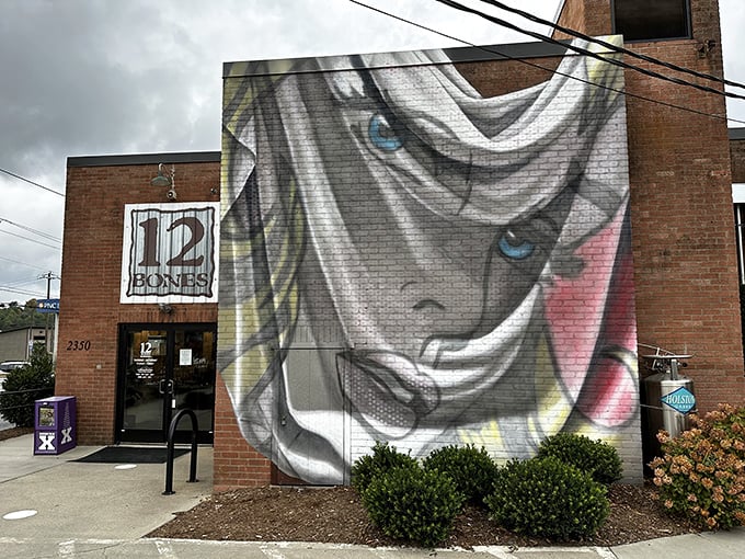 The brick fortress of flavor announces itself with artistic flair – a striking mural guards the entrance to this barbecue sanctuary like a delicious warning.