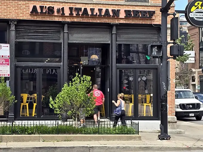 The unassuming storefront on Wells Street hides Chicago's beef royalty behind those sleek black frames and bright yellow chairs – like finding the Hope Diamond in your sock drawer.