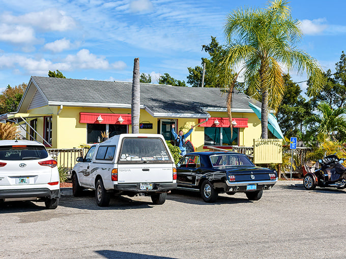 The little yellow house that could! Leo's French Toast House in Alva stands like a beacon of breakfast hope amid Florida's palm trees.