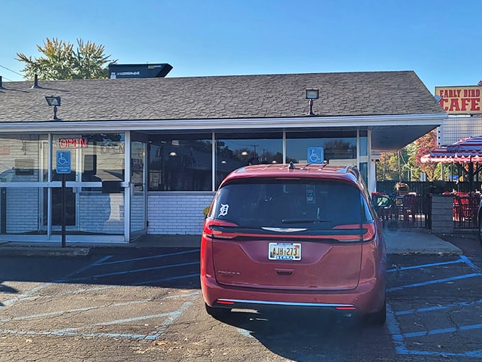 The unassuming exterior of Early Bird Cafe in Keego Harbor – where breakfast dreams come true behind that modest white brick facade.