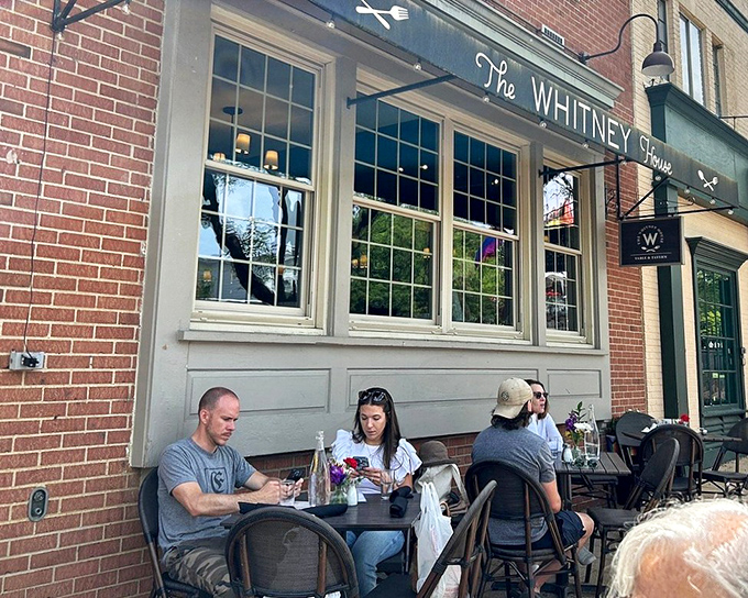 The Whitney House's charming brick exterior invites you in like an old friend who happens to be an exceptional cook.