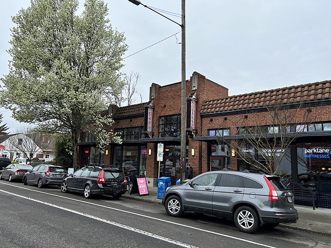 The brick façade of Cadillac Café stands proudly on a Portland street, promising culinary adventures behind those welcoming doors.