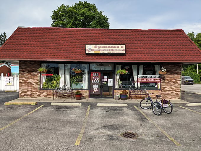 The unassuming exterior of Spennato's might not stop traffic, but trust me—what's happening inside this brick building with the red roof is culinary magic.