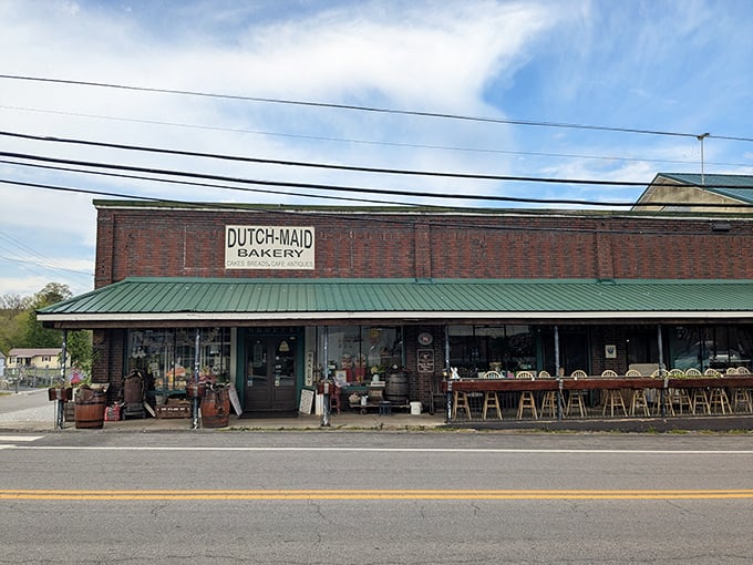 The charming storefront of Dutch Maid Bakery beckons with rustic barrels and vintage decor – like a time machine disguised as Tennessee's sweetest destination.