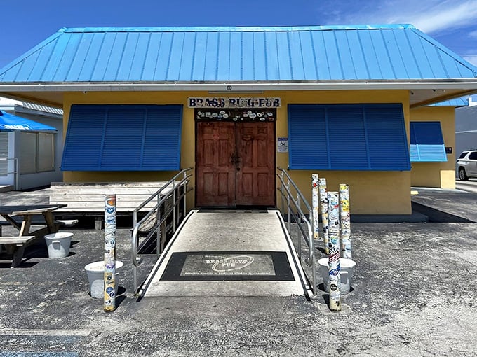 The unassuming yellow exterior with bright blue shutters is Florida's version of a treasure chest – inside lies burger gold instead of pirate booty.