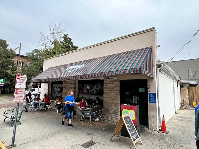 The colorful striped awning of Clary's beckons like an old friend, promising comfort food and conversations that flow as freely as the coffee.