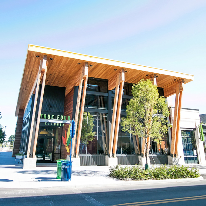 True Food Kitchen's wooden façade brings warmth to modern dining. The sleek signage promises what's inside: honest food that doesn't sacrifice flavor for health.