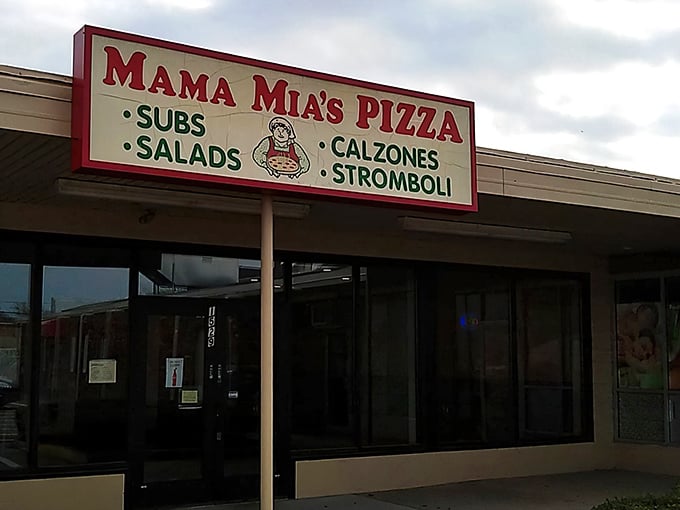 The unassuming storefront of Mama Mia's Pizza in Erie – where pizza pilgrimages begin and diet resolutions go to die.