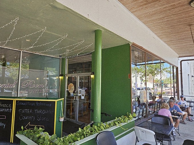 That distinctive green entrance column isn't just architectural flair—it's a beacon guiding hungry travelers to breakfast nirvana since before Instagram made food photos a thing.