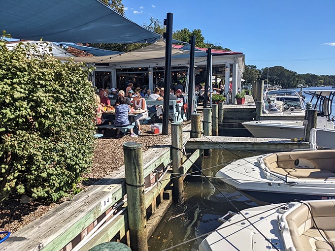 Paradise found! The Point Crab House perches right on Mill Creek like a seabird ready to dive, with boats bobbing nearby and shade sails fluttering in the breeze.
