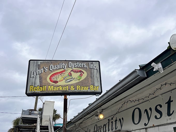 The weathered sign says it all: Lynn's Quality Oysters isn't just a restaurant—it's a Florida institution where seafood dreams come true.