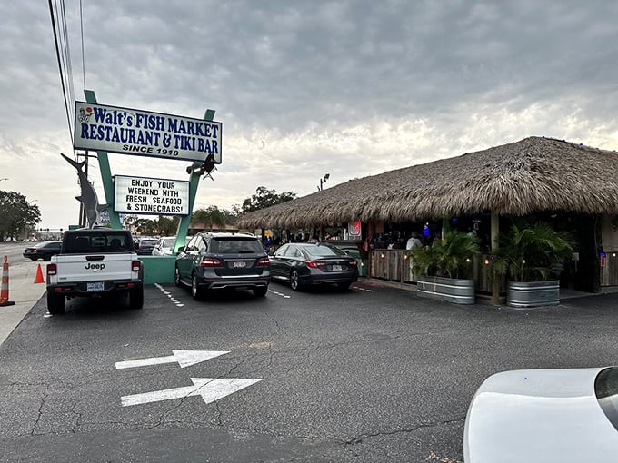 That iconic roadside sign has guided hungry seafood pilgrims for decades, a neon lighthouse for those navigating the waters of culinary decision-making.