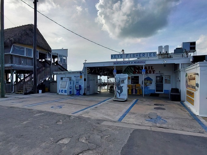 The unassuming entrance to Keys Fisheries stands like a culinary lighthouse, beckoning seafood lovers with promises of ocean-fresh delights in Marathon.