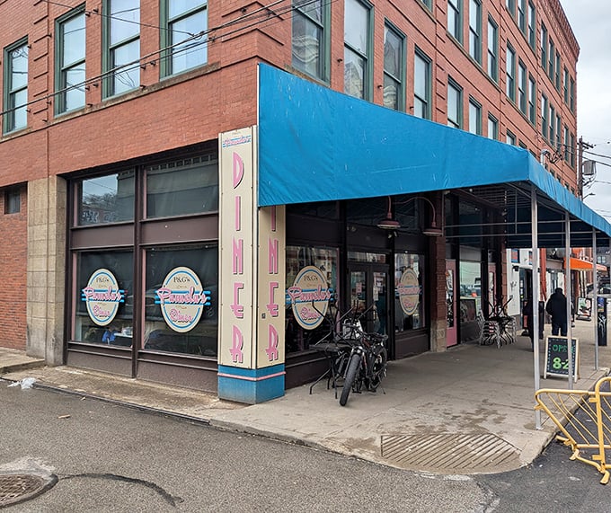 The iconic blue awning of Pamela's Diner in Pittsburgh's Strip District stands as a beacon for breakfast pilgrims seeking morning salvation.