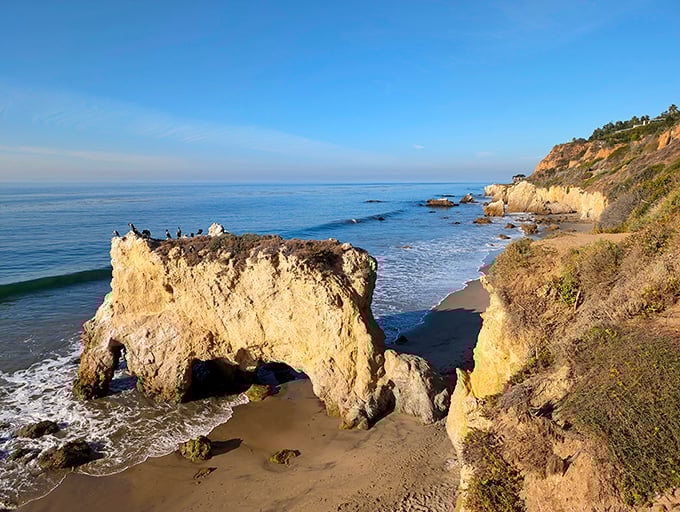 Nature's own sculpture garden where golden cliffs meet azure waters. El Matador's iconic rock formations stand like sentinels guarding California's most photogenic shoreline.