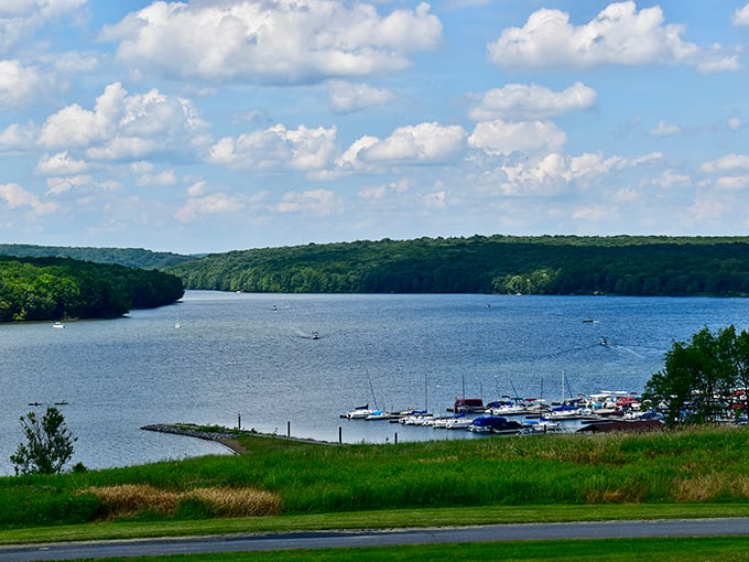 Glendale Lake stretches like a blue ribbon through the forest, where boats dot the water and Pennsylvania's natural splendor unfolds in every direction.