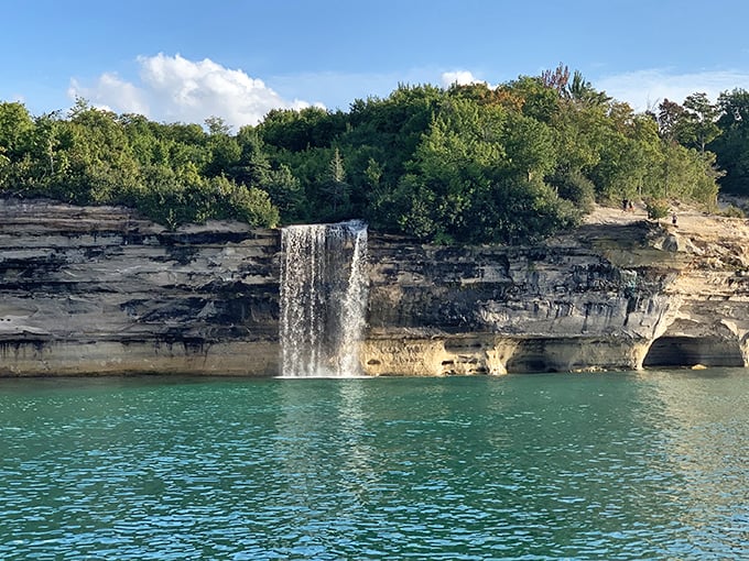 Mother Nature's own waterfall masterpiece cascades directly into Lake Superior's turquoise waters, no special effects needed.