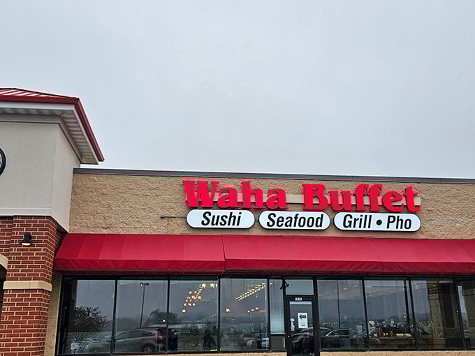 The bright red signage of Waha Buffet stands out against the beige building, promising a seafood adventure in suburban Franklin.
